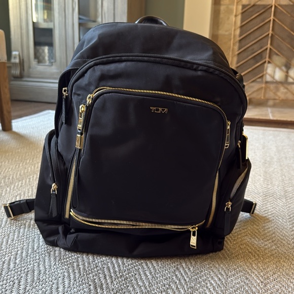 Tumi | Bags | Tumi Black And Gold Backpack | Poshmark